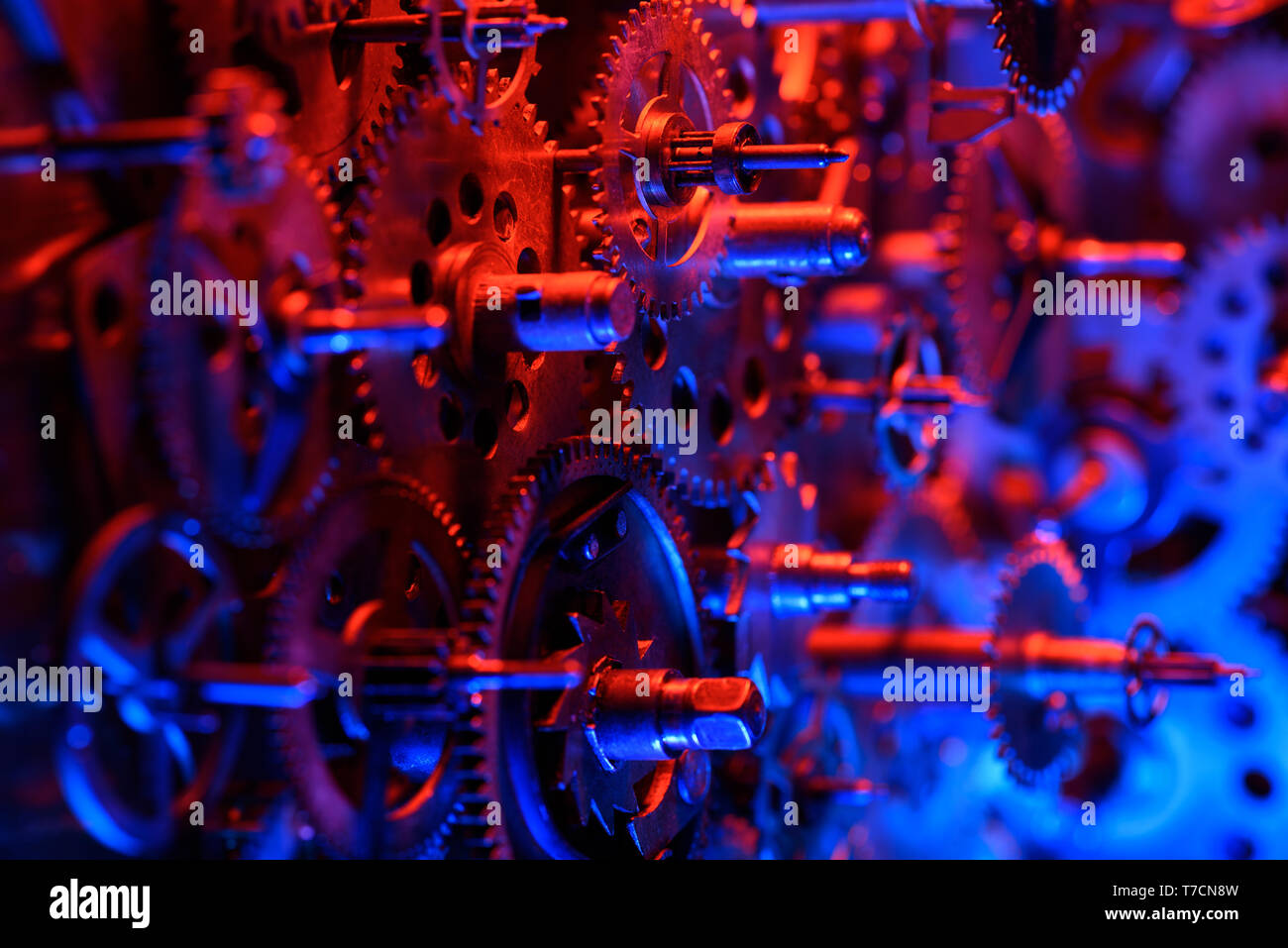 Gears and cogs red and blue light colored Stock Photo - Alamy