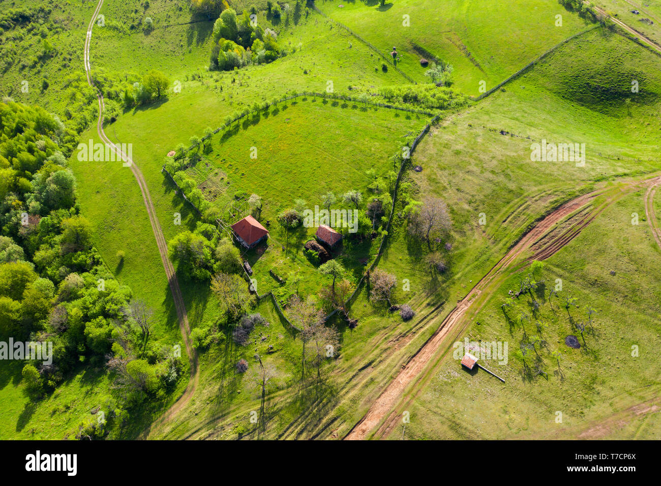 Aerial view of a countryside homestead houses in the mountains by drone ...