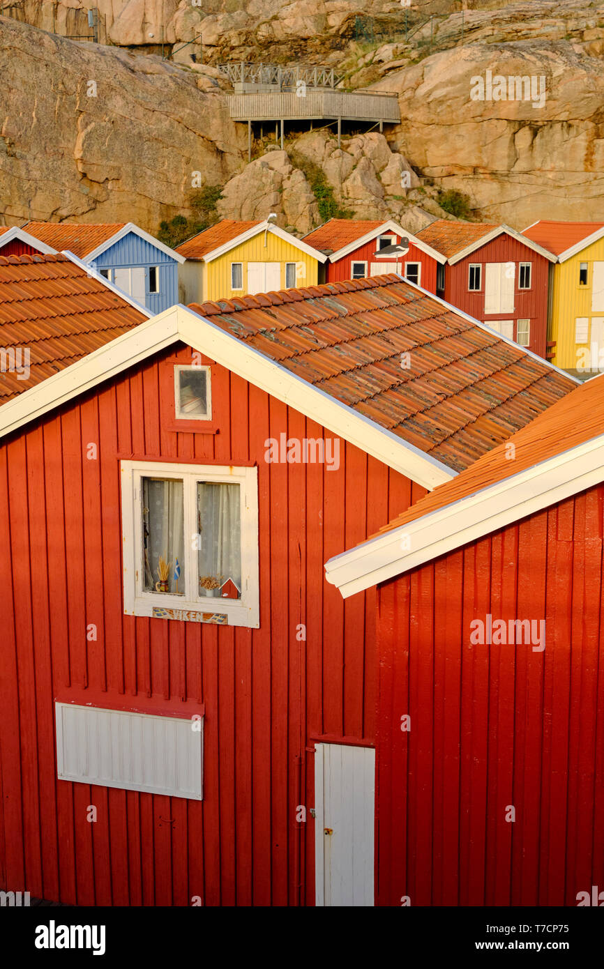 Colourfully painted timber traditional fishing boat huts / cabins in ... Colourfully painted timber traditional fishing boat huts / cabins in ...