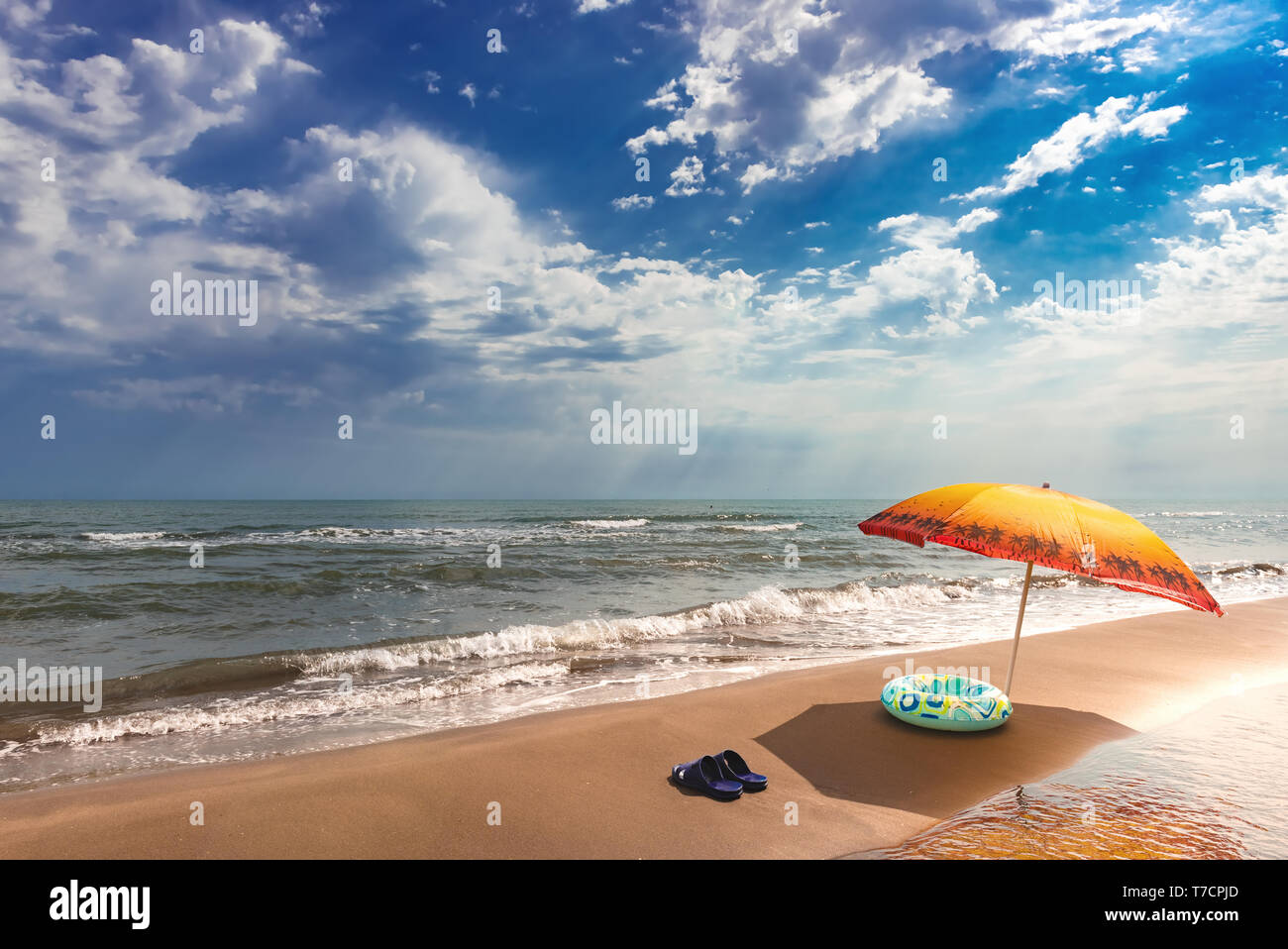 Summer holiday on the beach with golden sand Stock Photo - Alamy