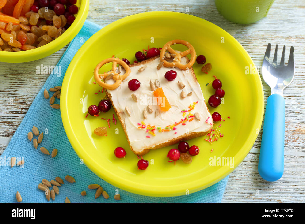 Plate with creative sweet toast for child on wooden table Stock Photo ...