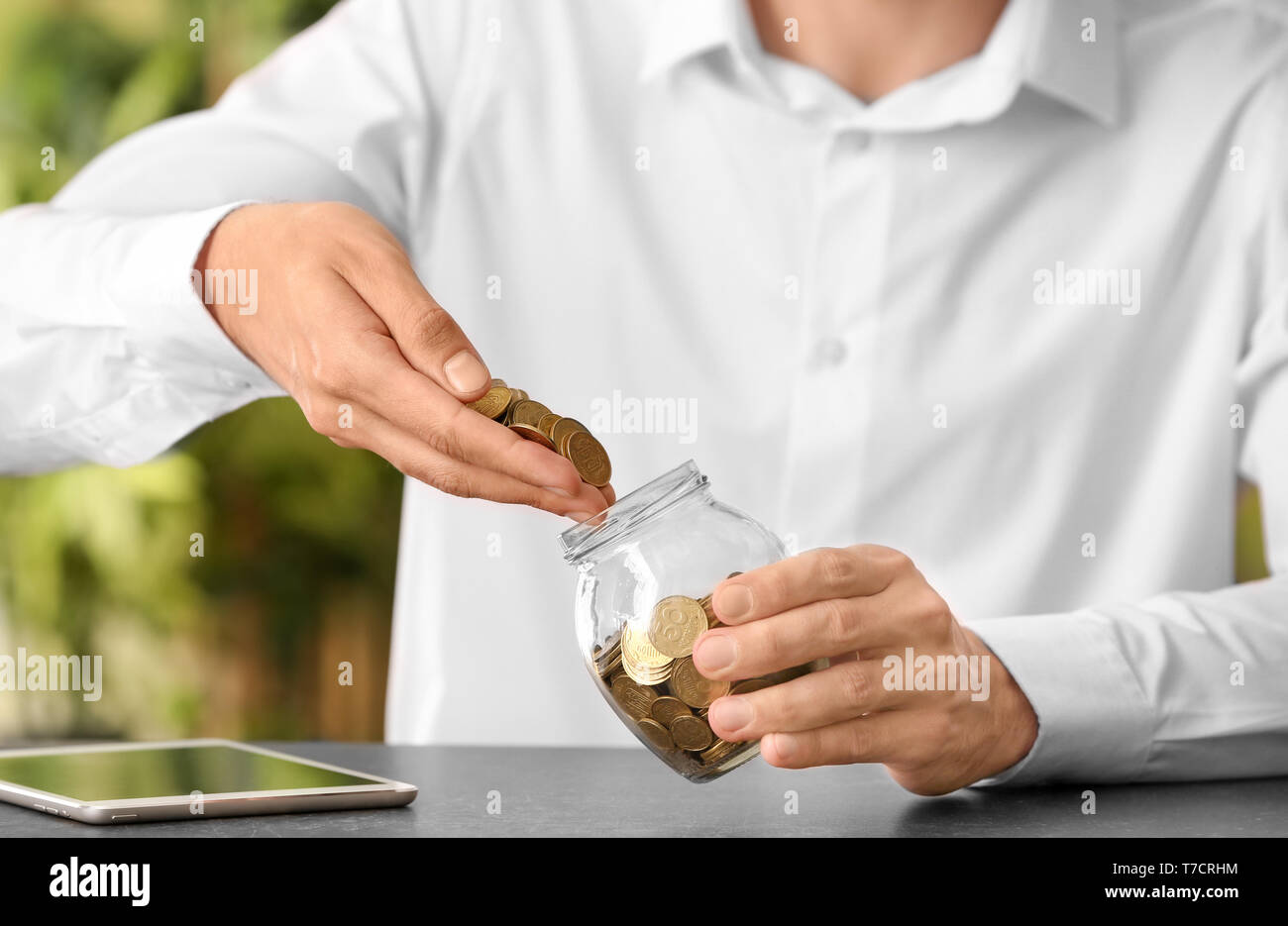 Pouring coins hi-res stock photography and images - Alamy