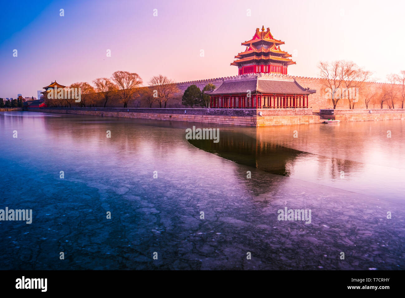 The wall and frozen moat of the Forbidden City at sunset. Beijing ...