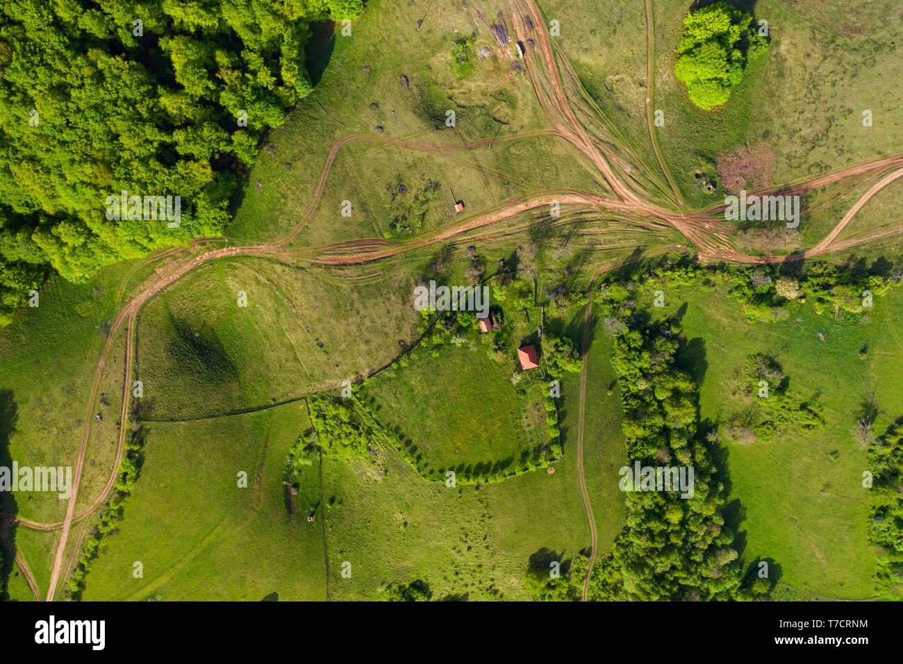 Aerial view of a countryside homestead houses in the mountains by drone ...