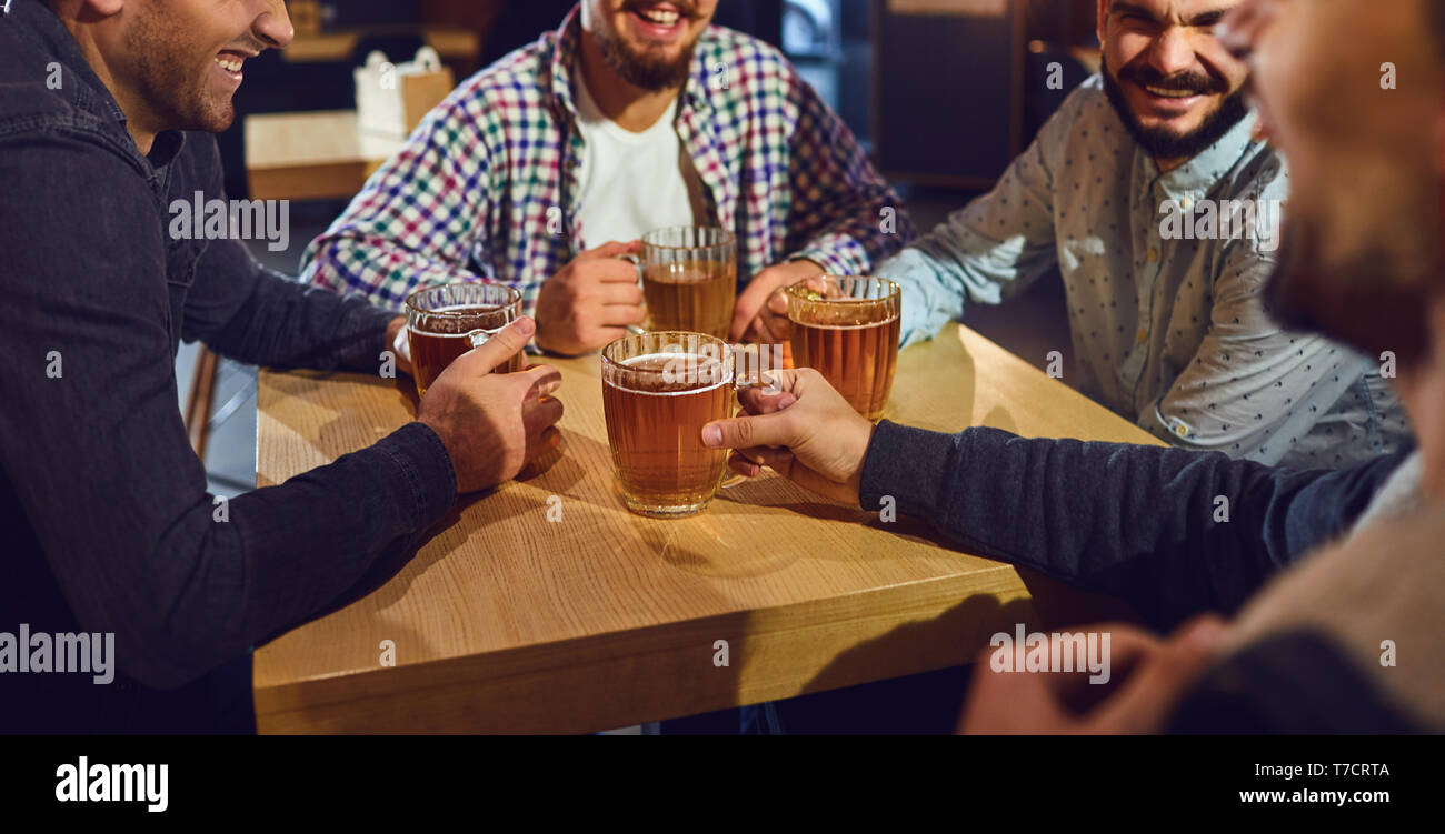 Beer friends free time concept. Cheerful friends with glasses and beer ...