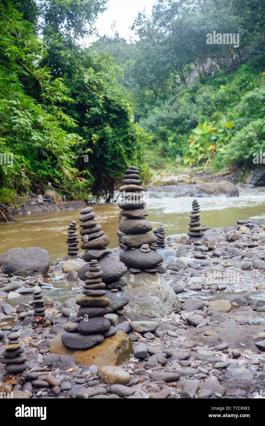 View at stacked zen stones at Tegenungan Waterfall at Bali, Indonesia ...