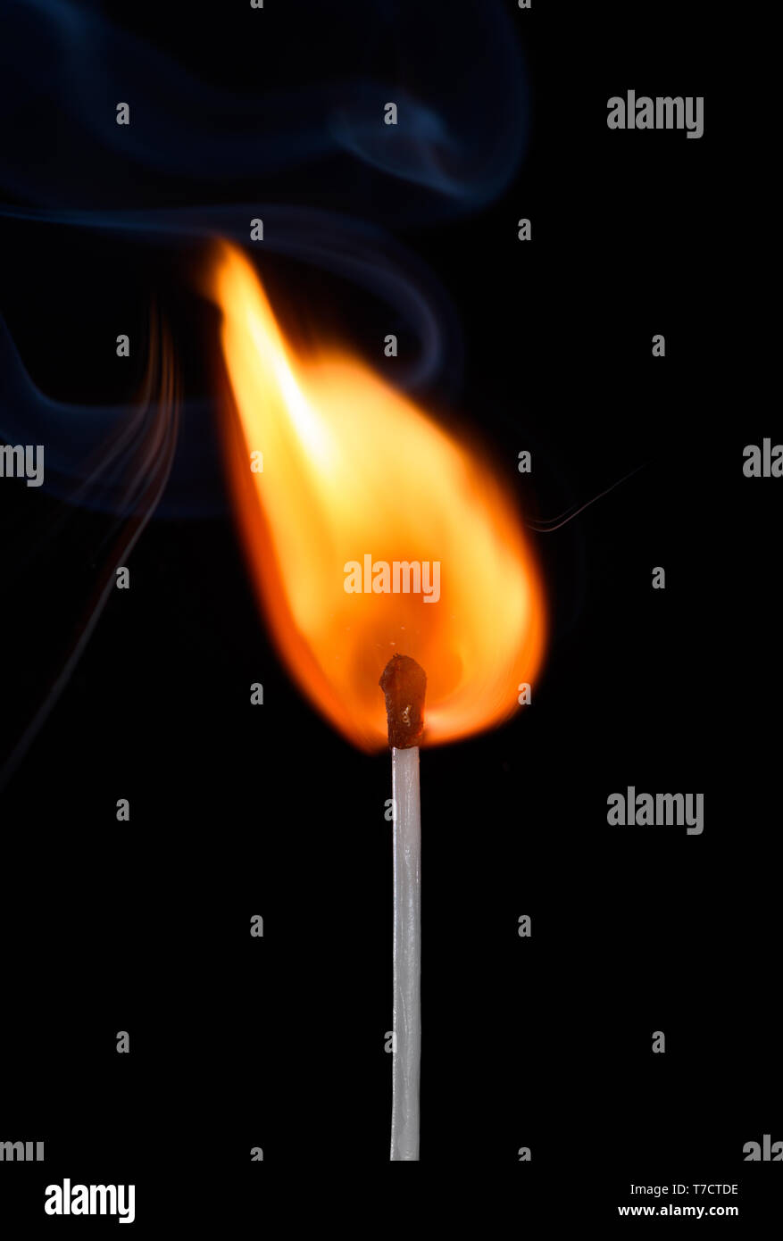 Single match stick burning bright big fire isolated on black Stock ...