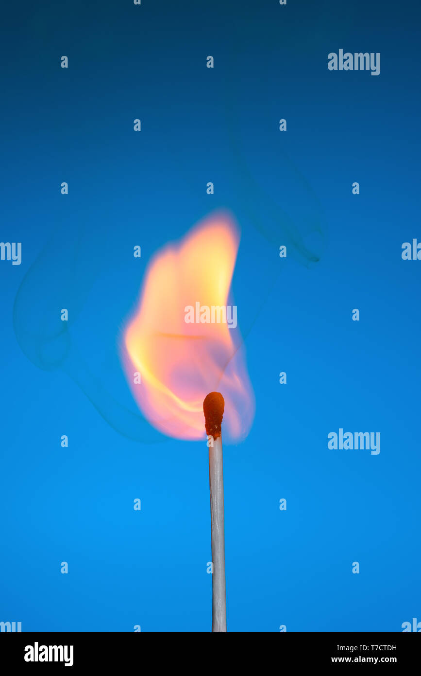 Match flame blue background hi-res stock photography and images - Alamy