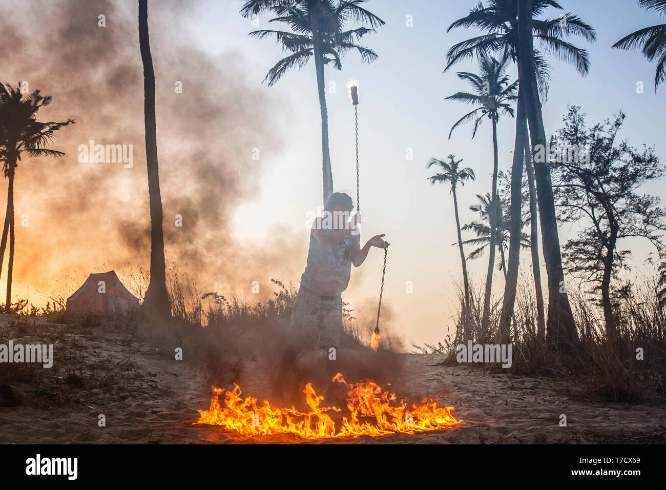 Man doing fire show at Arambol beach in India Stock Photo - Alamy