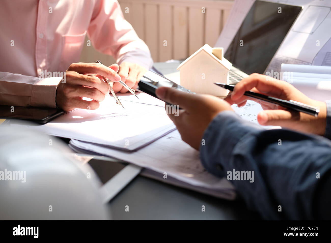 architect engineer team working on house blueprint of real estate ...