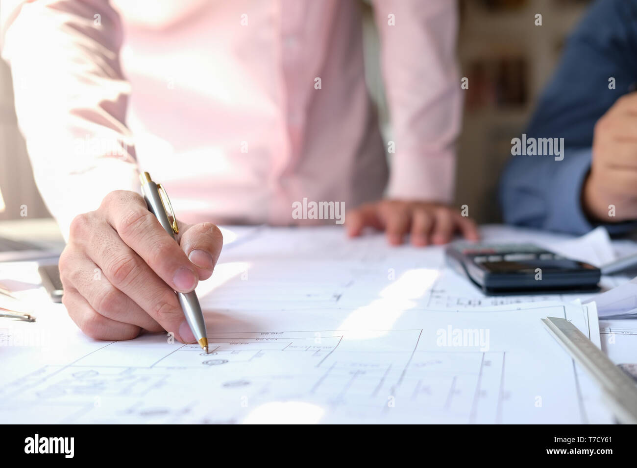 architect engineer team working on house blueprint of real estate ...