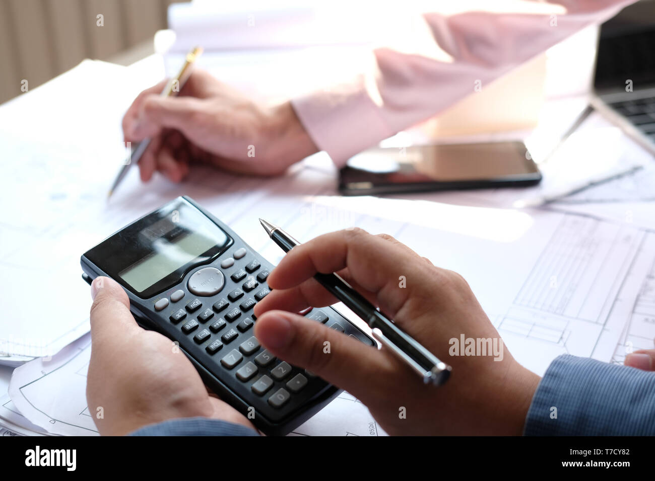 architect engineer team working on house blueprint of real estate ...