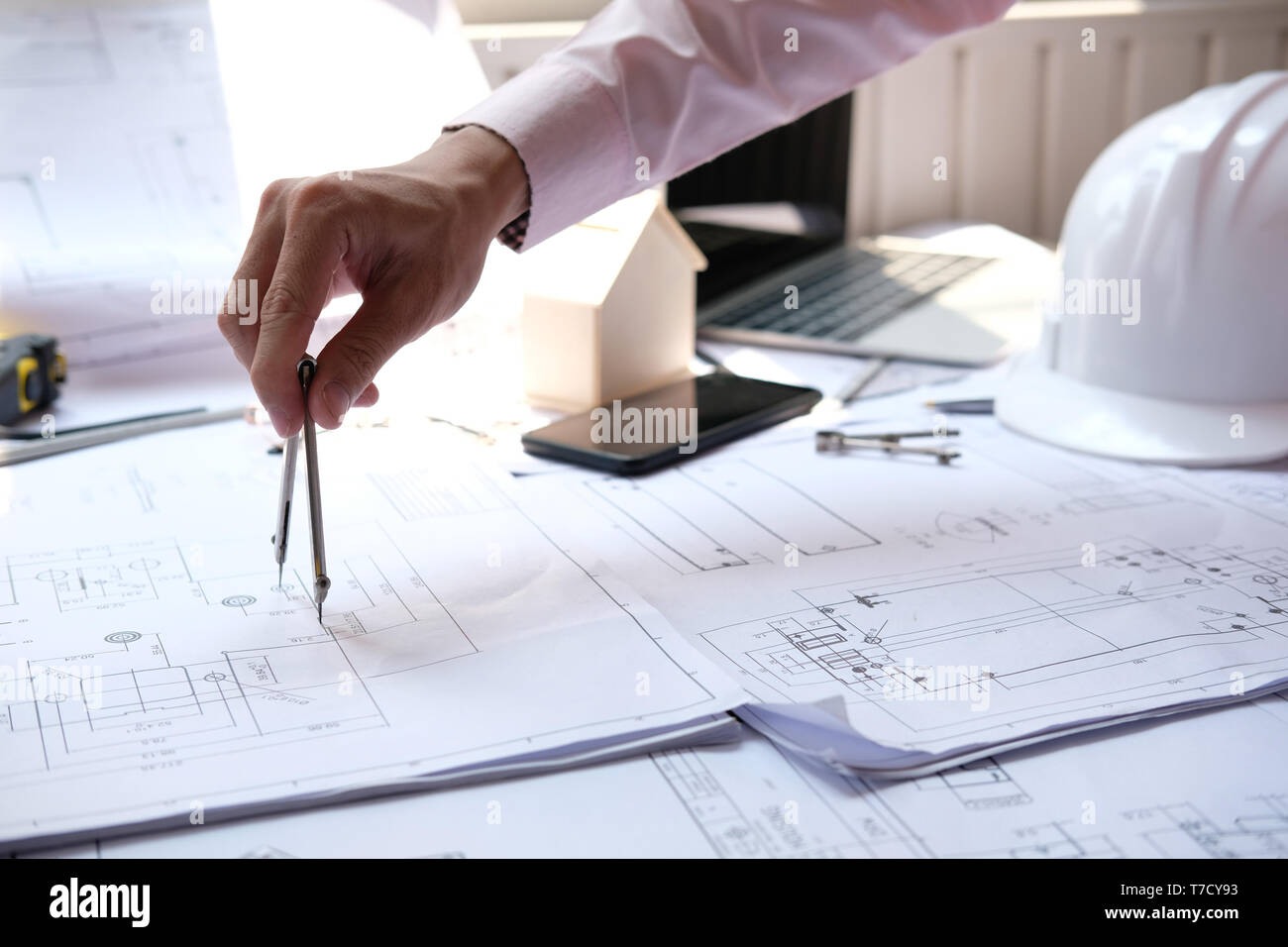 architect engineer working on house blueprint of real estate project at ...