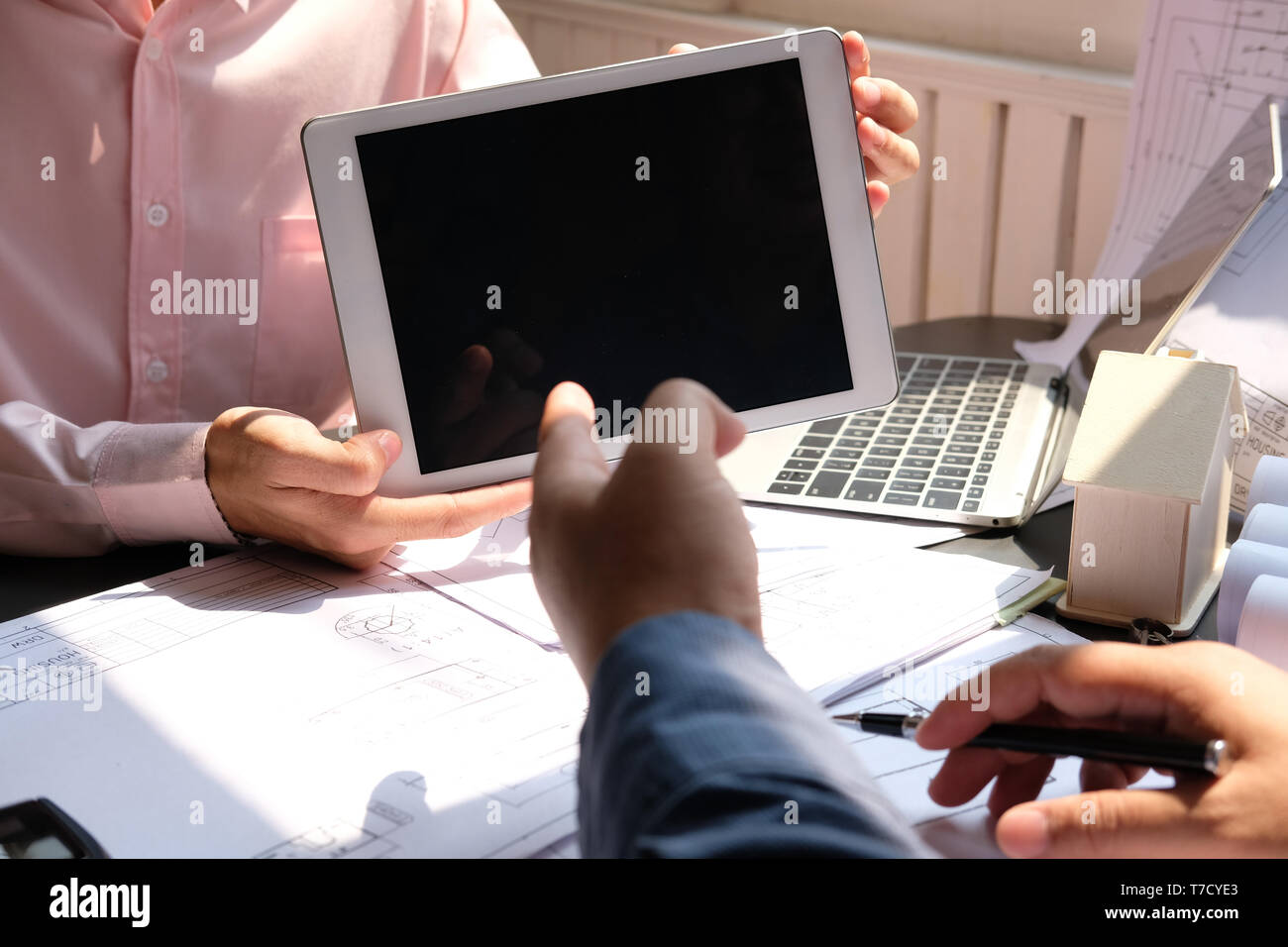 architect engineer team working on house blueprint of real estate ...