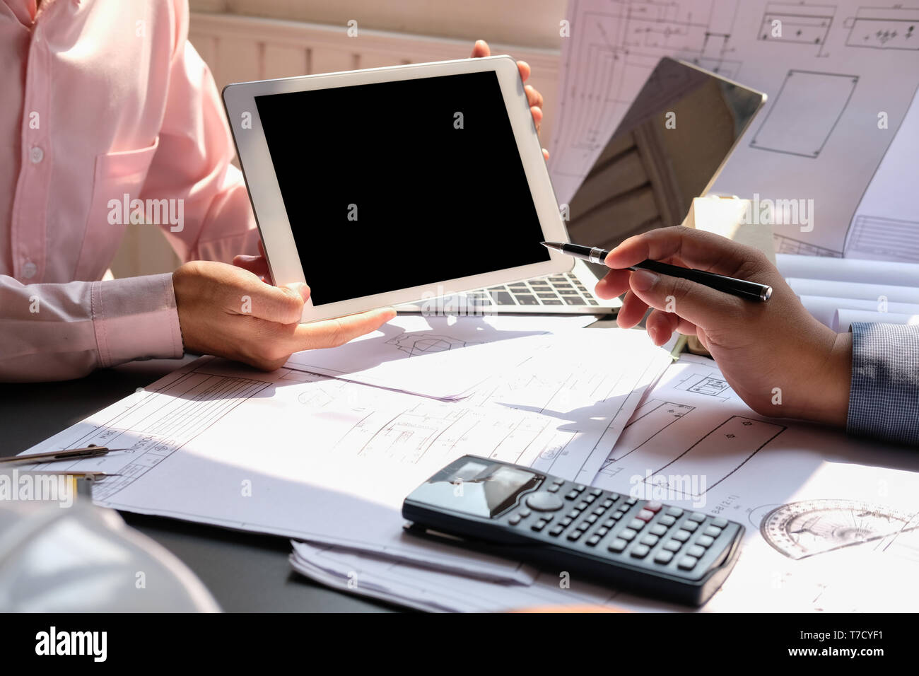 architect engineer team working on house blueprint of real estate ...