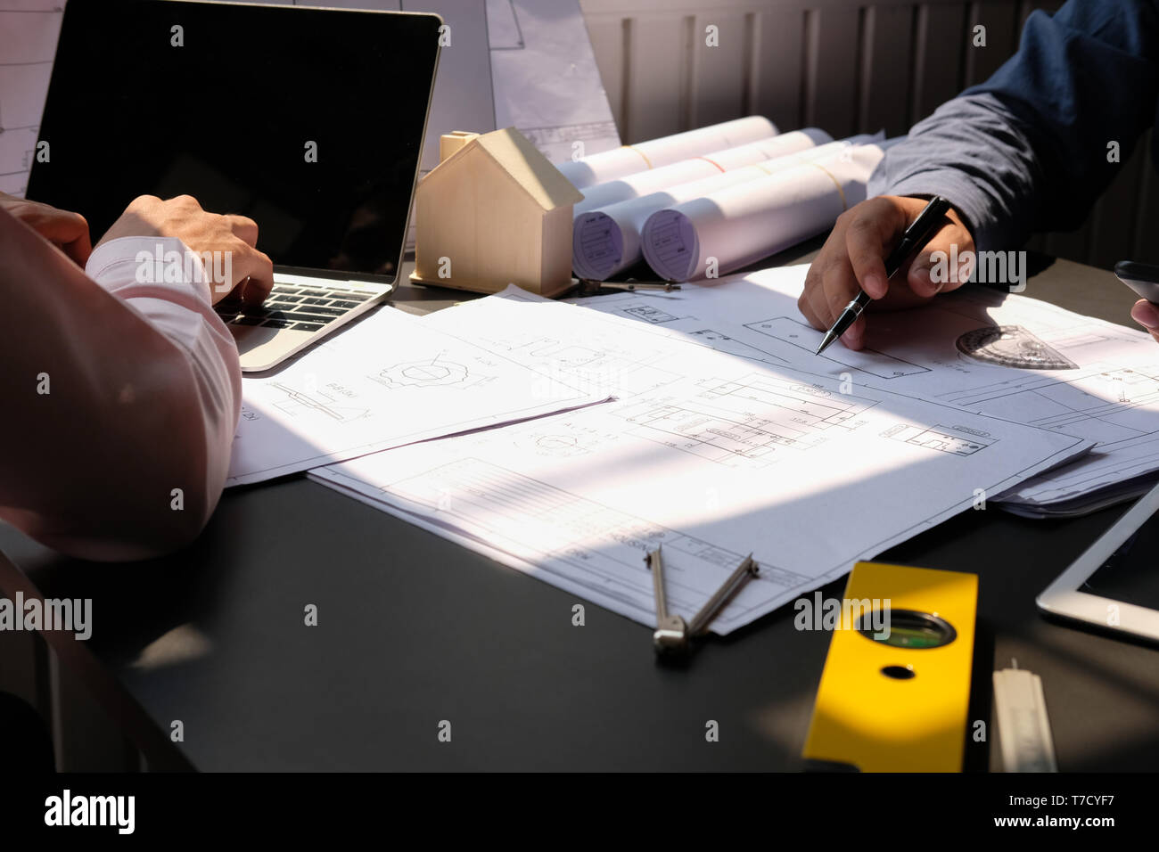 architect engineer team working on house blueprint of real estate ...