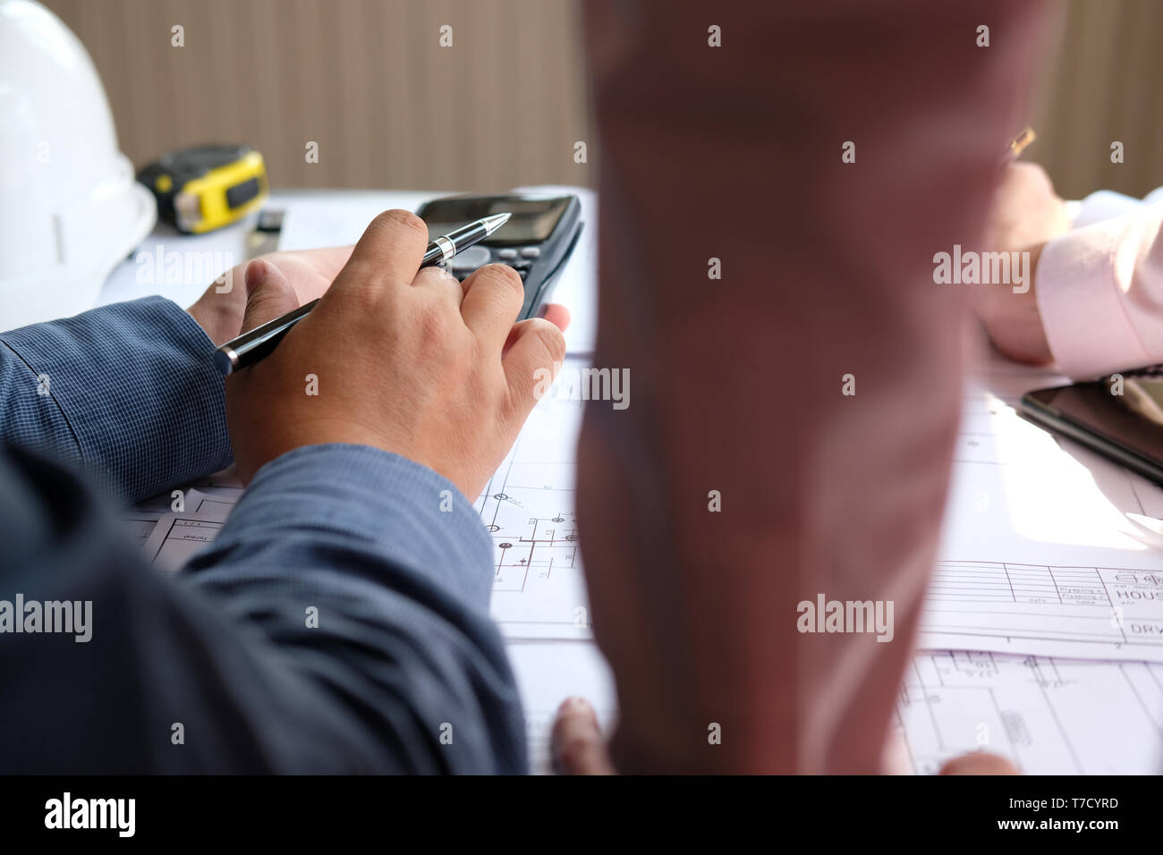 architect engineer team working on house blueprint of real estate ...