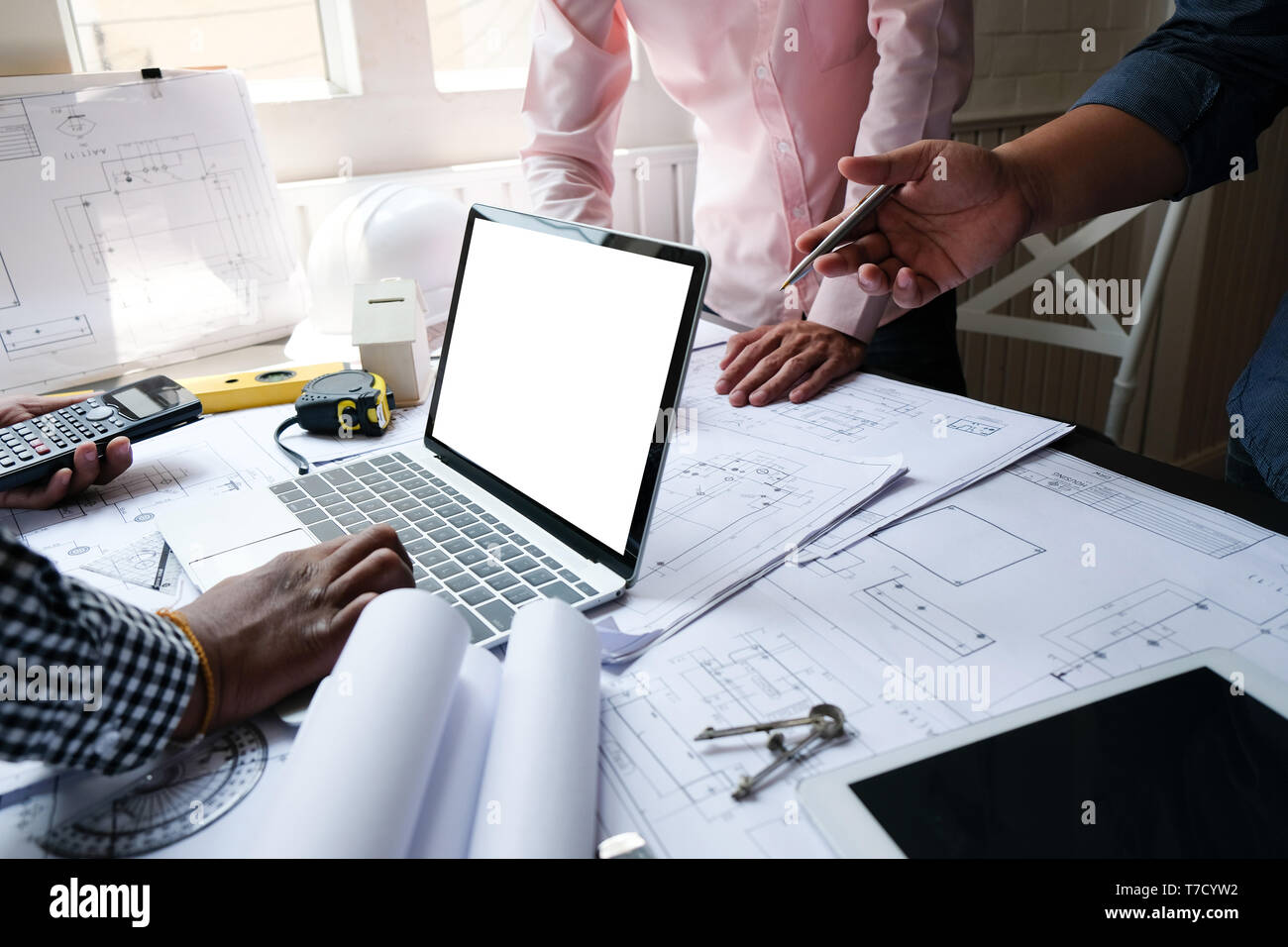 architect engineer team working on house blueprint of real estate ...