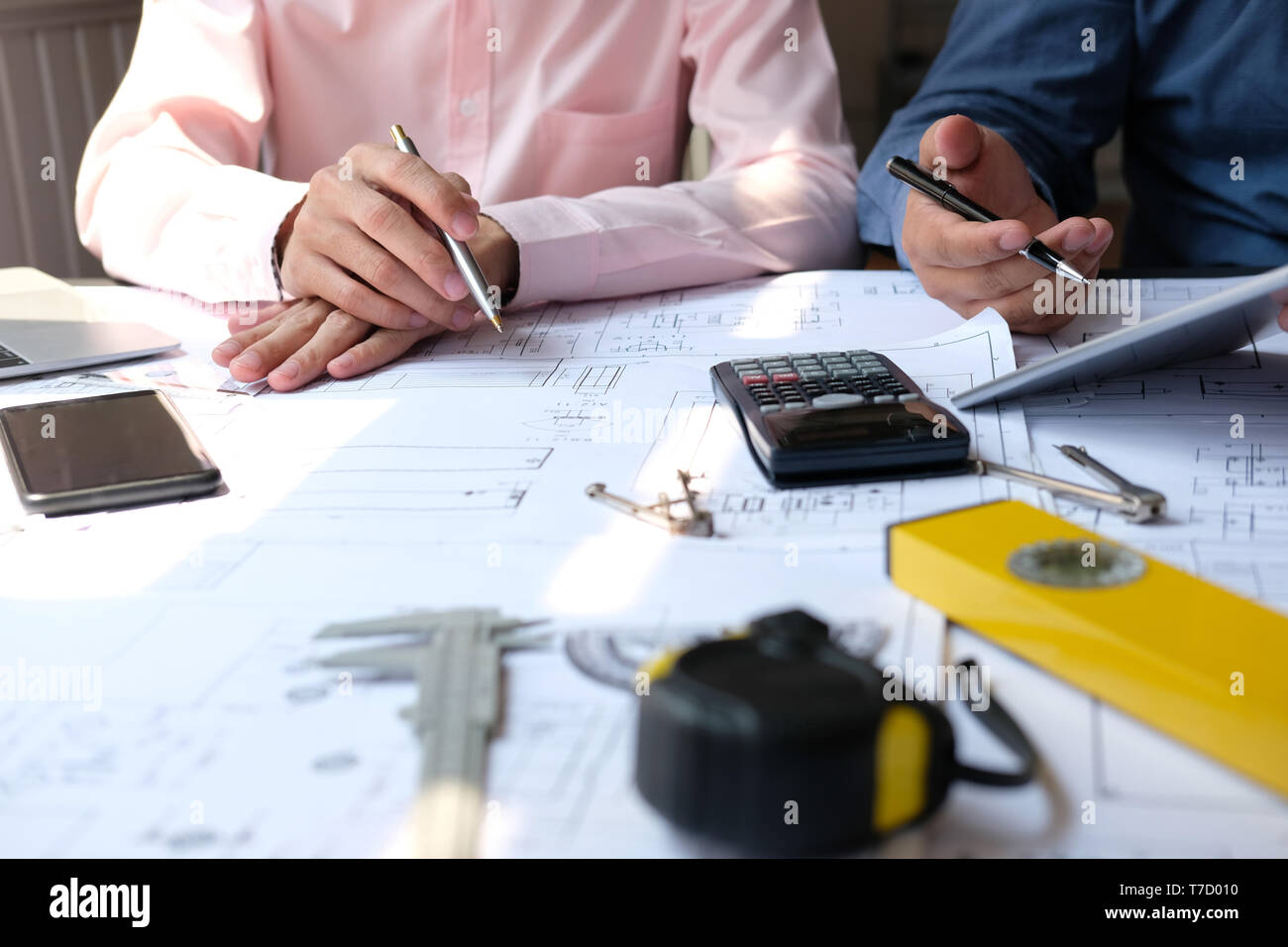 architect engineer team working on house blueprint of real estate ...