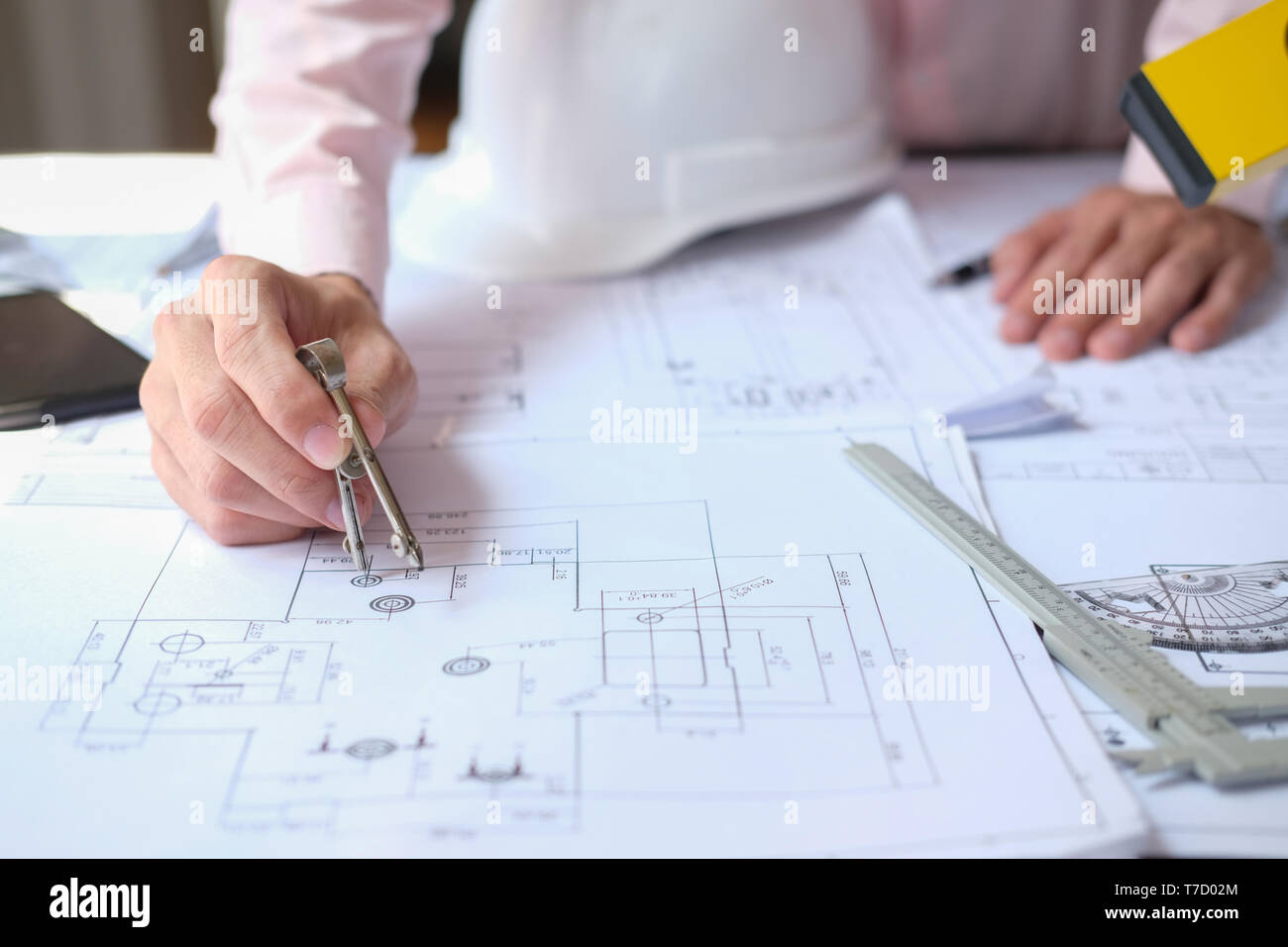 architect engineer working on house blueprint of real estate project at ...