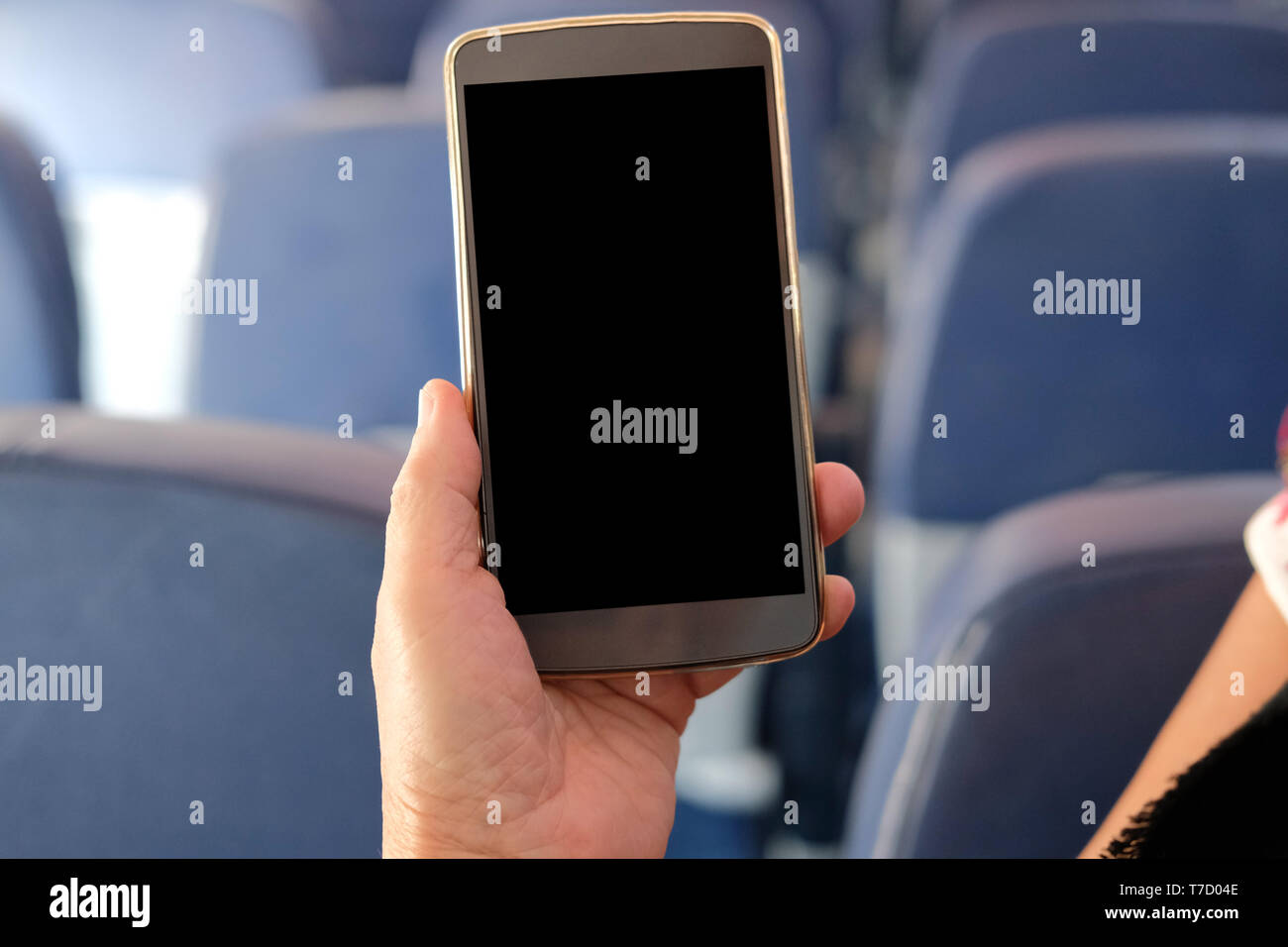 hand holding mobile smart phone on airplane Stock Photo - Alamy