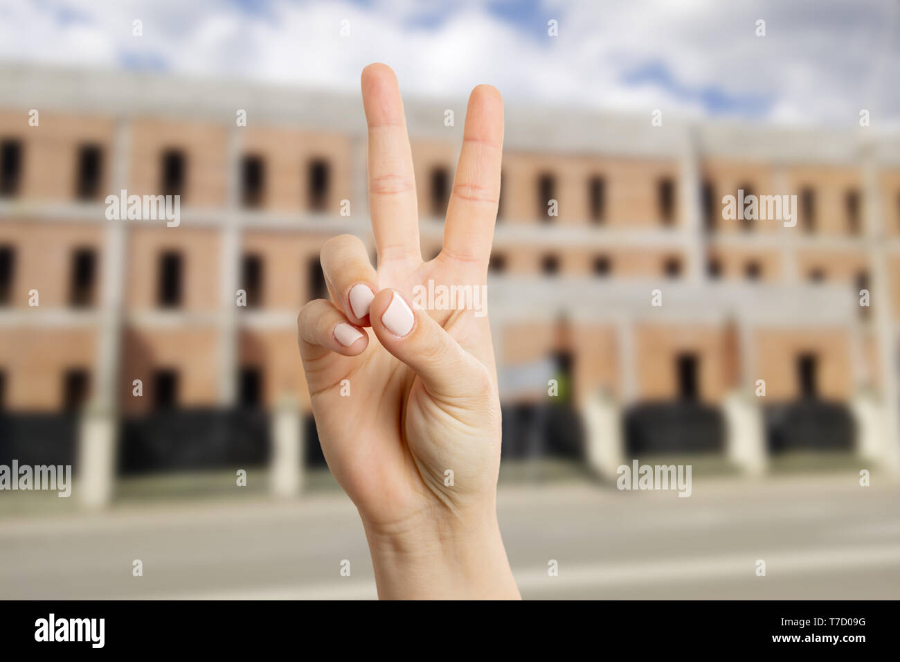 Woman making peace sign hi-res stock photography and images - Alamy
