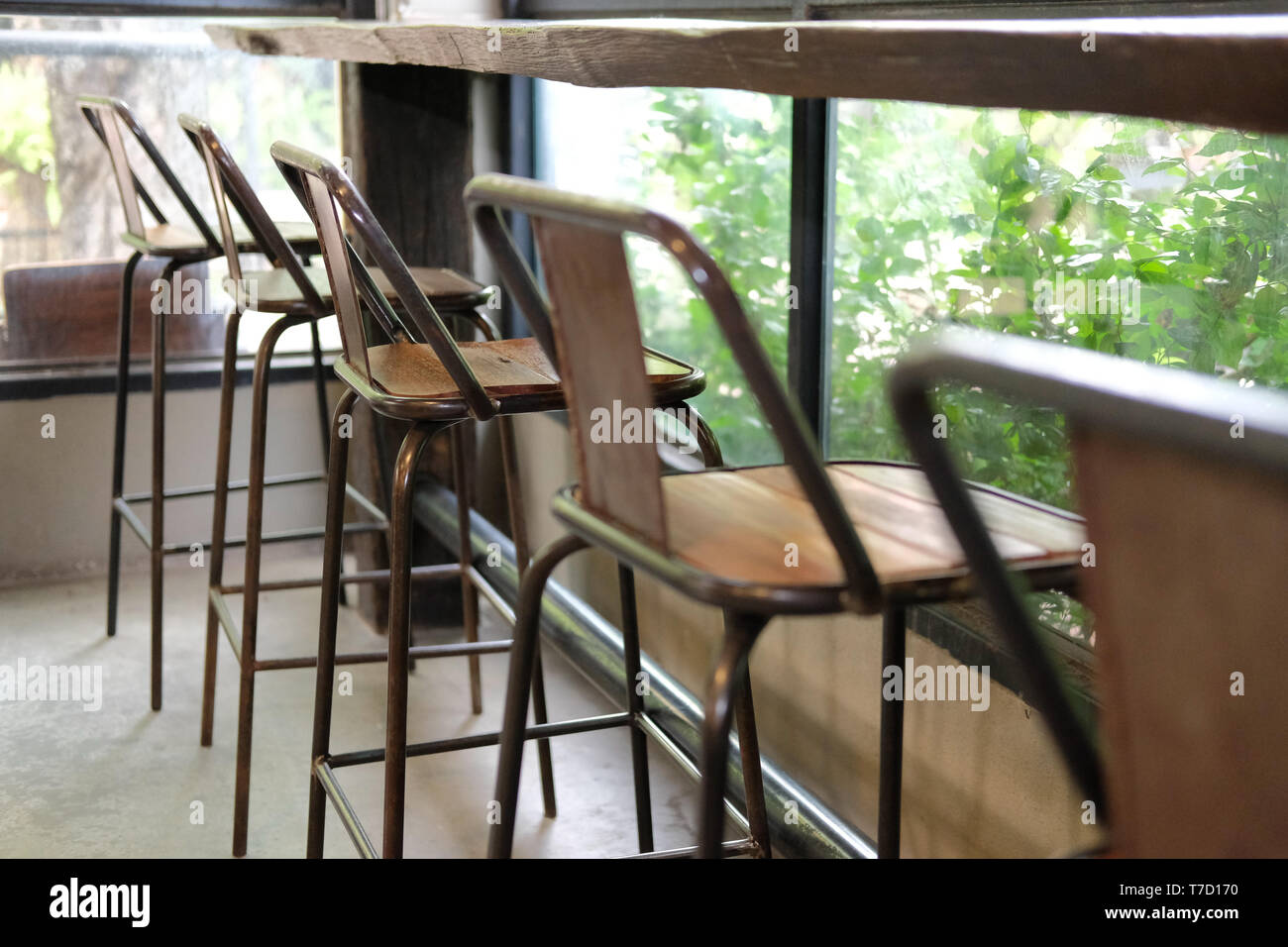 stool in cafe coffee shop restaurant near garden window Stock Photo - Alamy