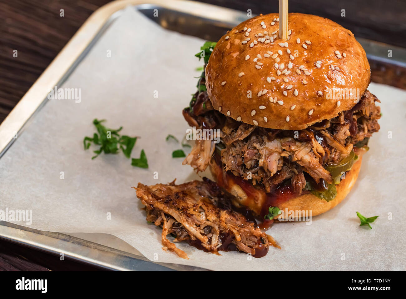 Close up tasty burger with minced meat served on tray Stock Photo - Alamy
