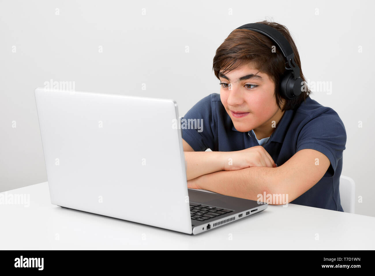 Teenage boy watching computer screen hi-res stock photography and ...