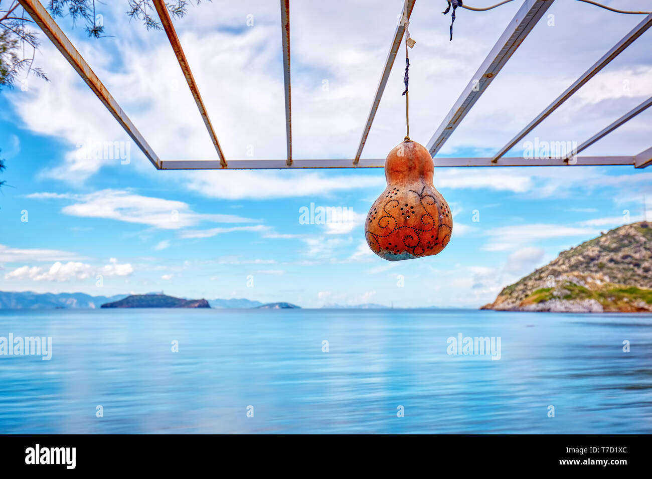 Decorative calabash gourd lantern hanging against the sea and sky ...