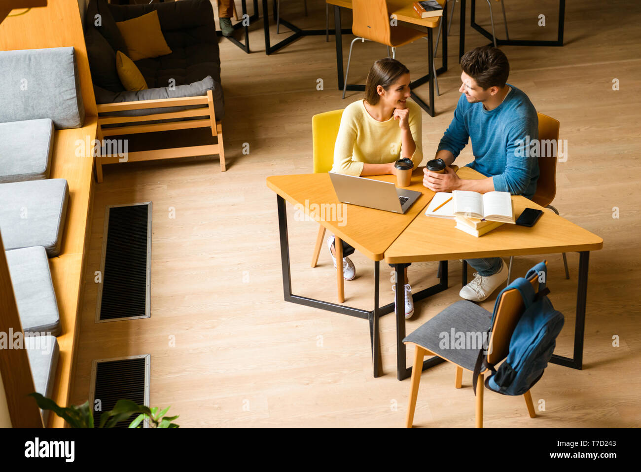 Image of a young students friends couple in library doing homework ...