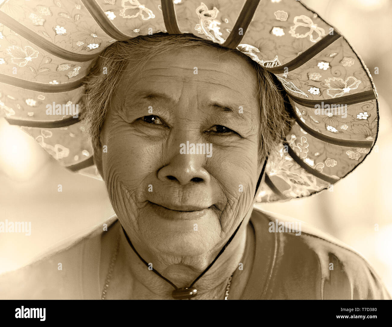 Beautiful face portrait of with soft eyes and a smile wearing a ...