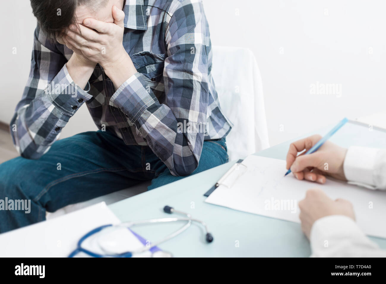 A male patient consults with a doctor about prostate cancer or some ...