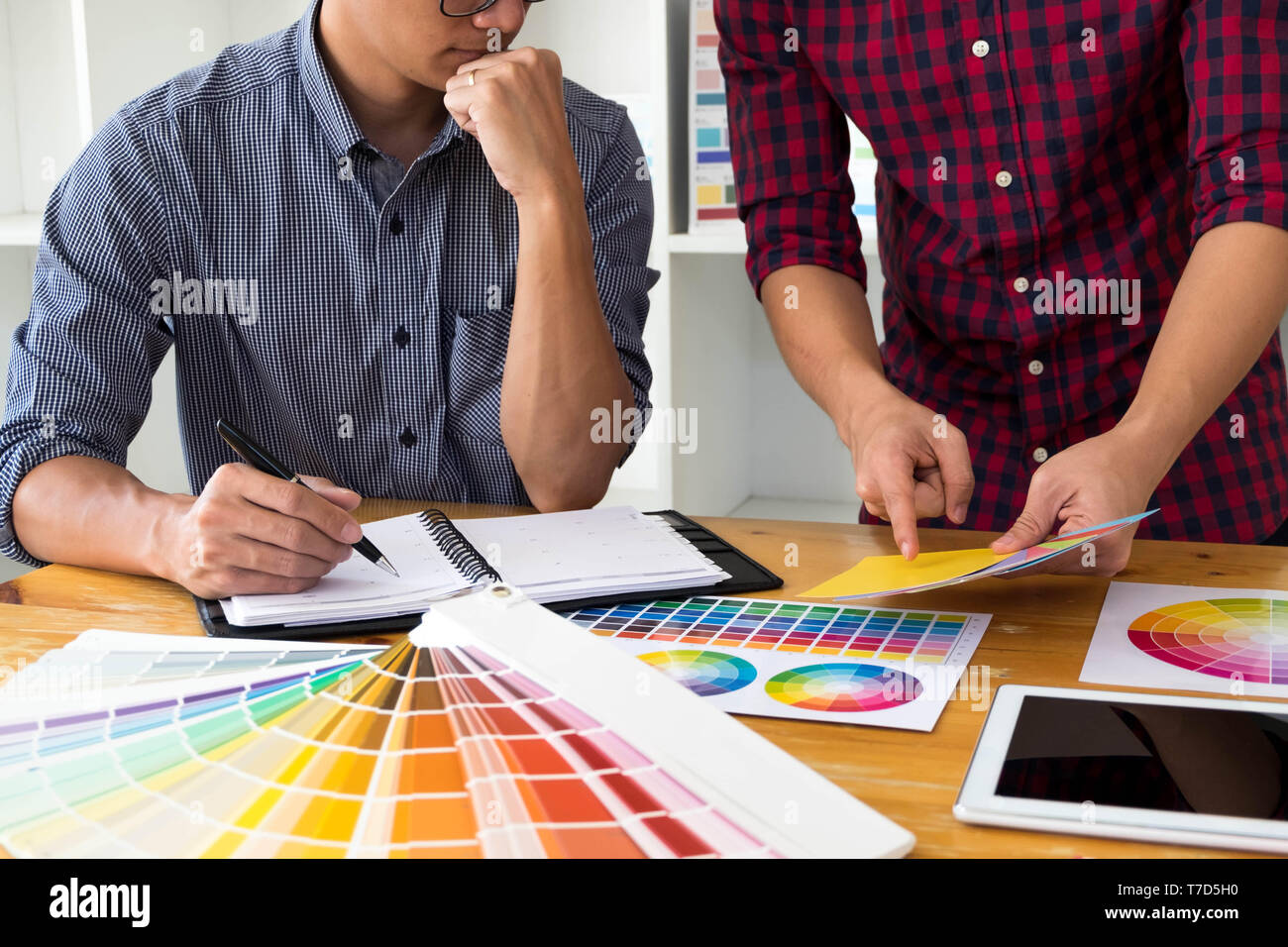 Graphic designers choose colors from the color bands samples for design ...