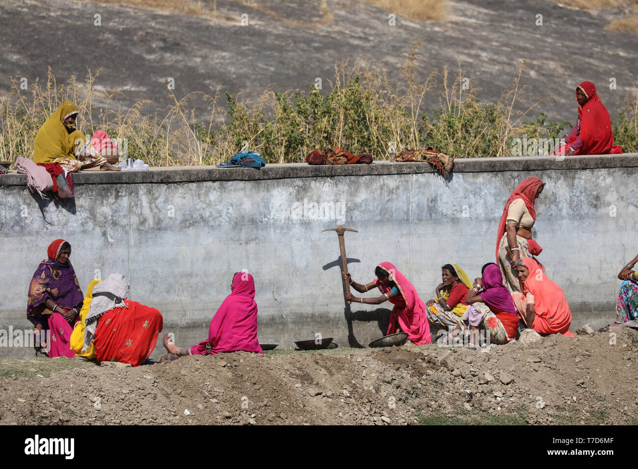 Woman in India with hoe working on the street Stock Photo - Alamy