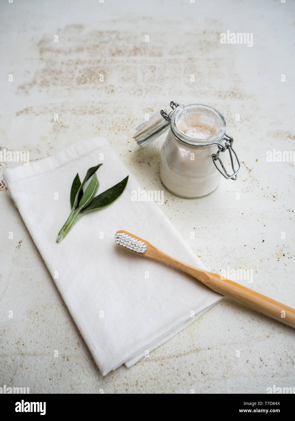 DIY homemade vegan toothpaste in a small glass jar following a zero ...