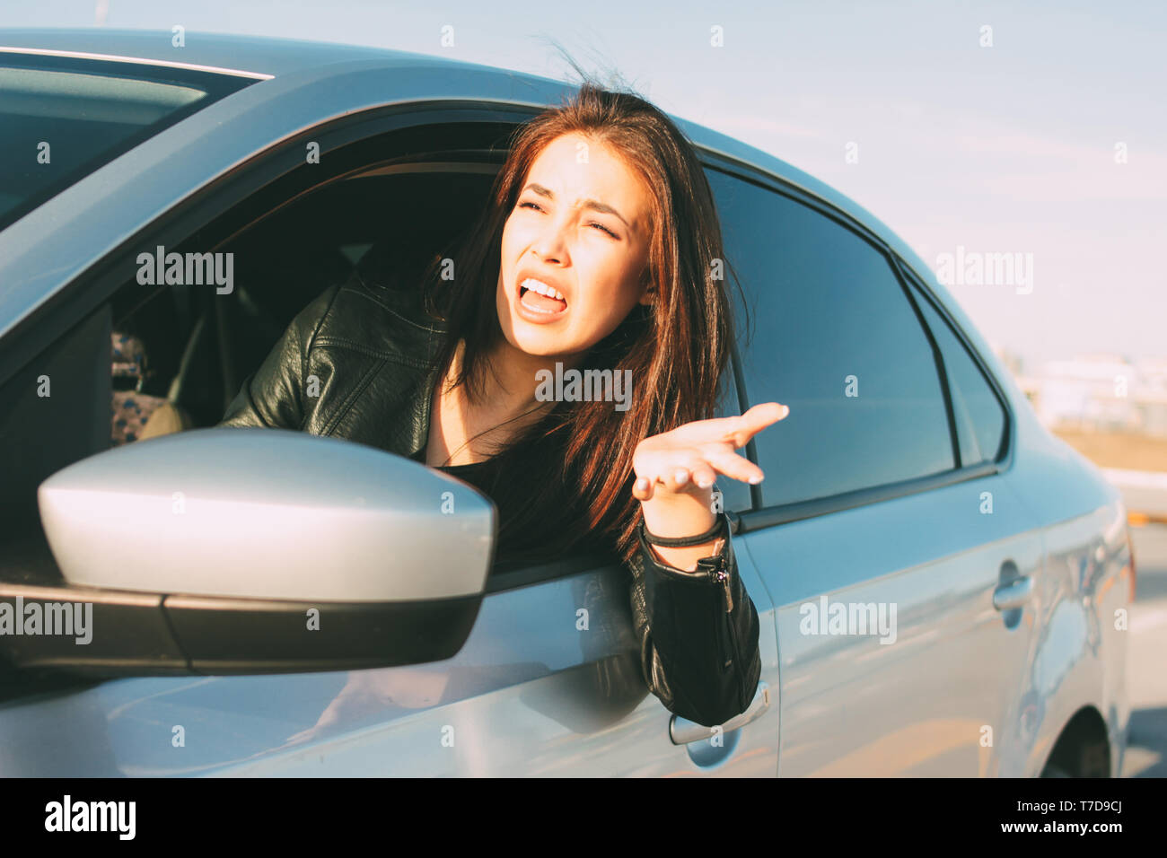 Beautiful brunette long hair angry young asian woman driving and ...