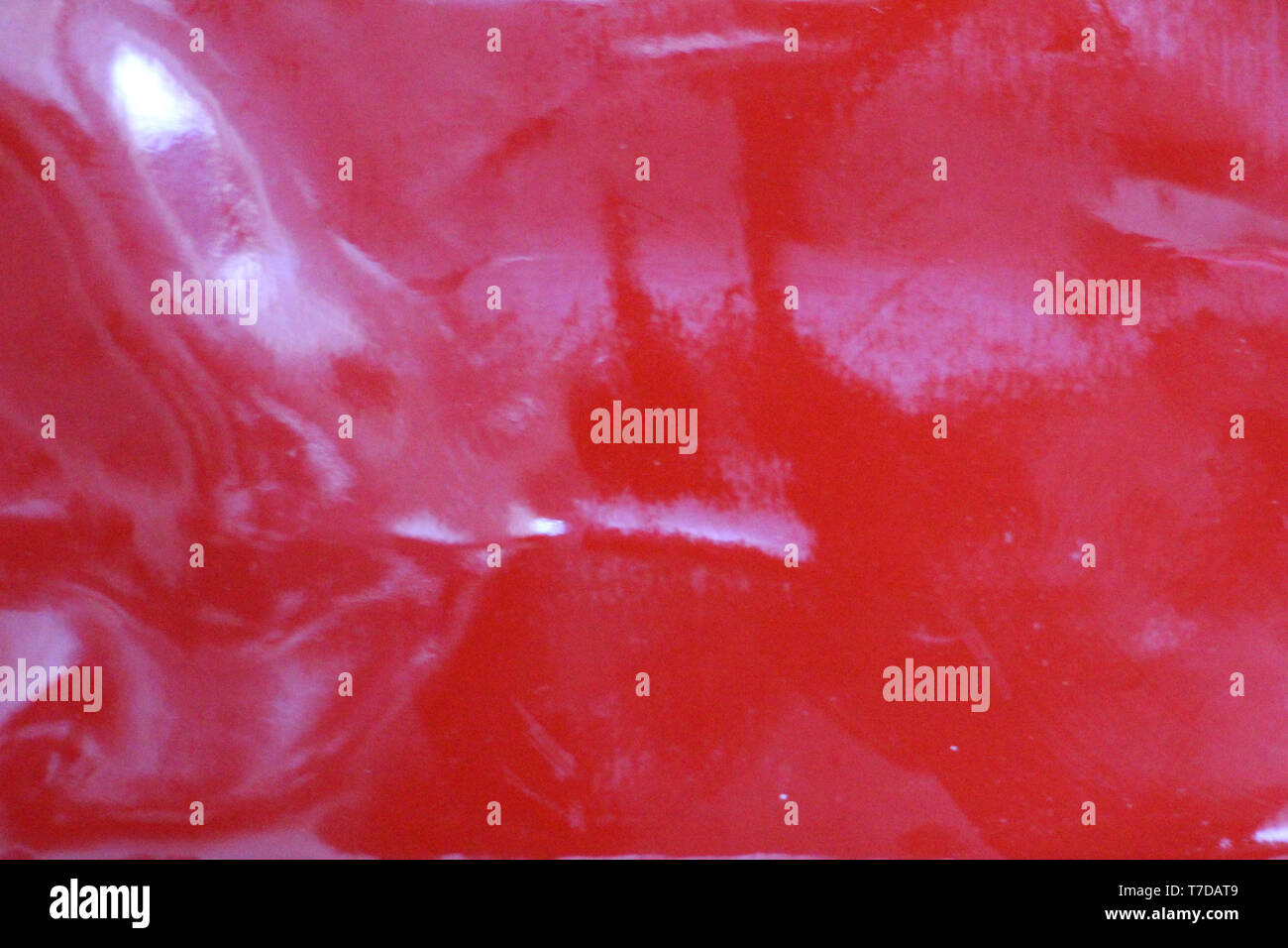 The texture of red oilcloth. Saturated red polyethylene, close-up ...