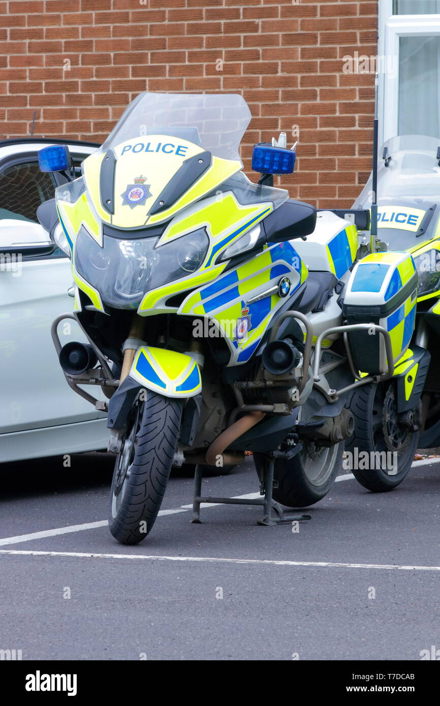 A BMW police motorcycle parked up , before setting off in convoy to ...