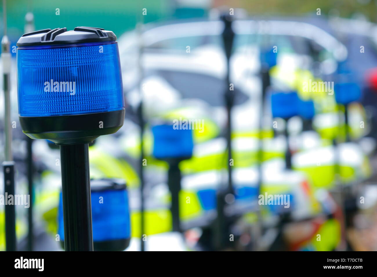 Abstract of blue lights from a convoy of parked police motorcycles ...