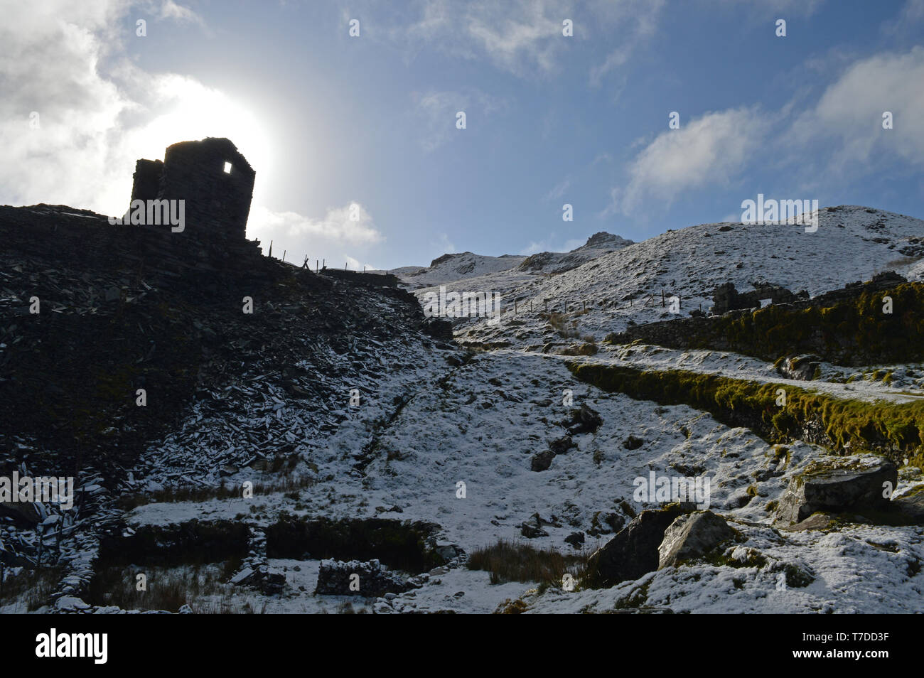 Slate building backlit by morning sun at Croesor slte quarry Snowdonia ...
