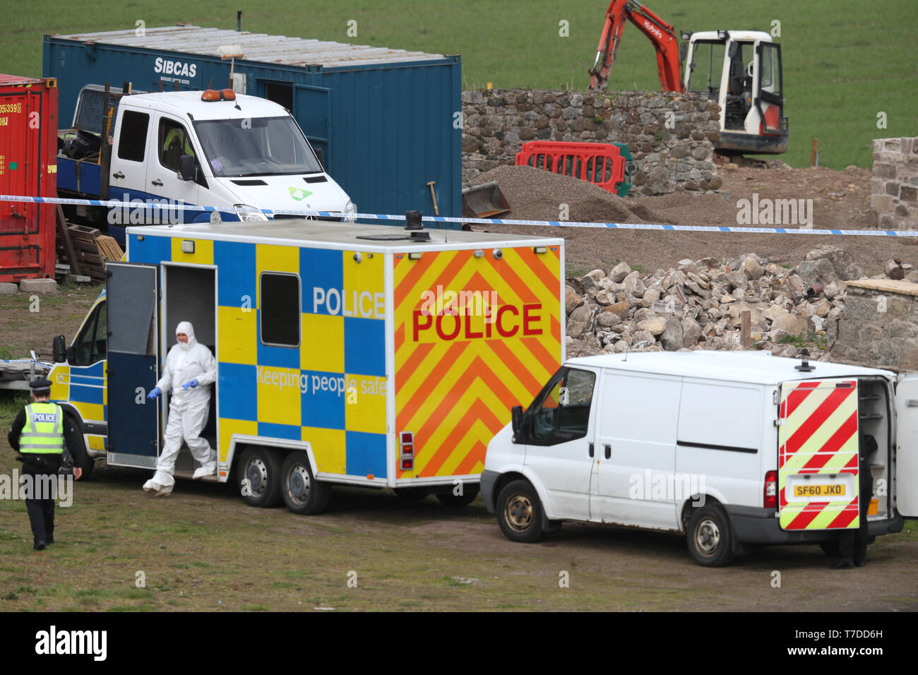 Police and forensic officers attend the scene at a farm near Linlithgow ...