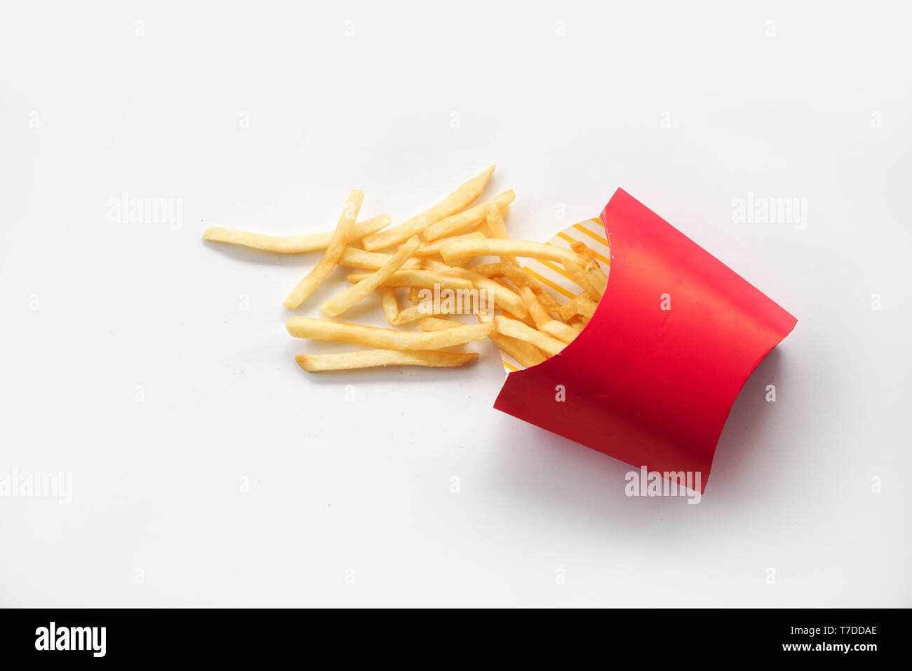 French fries in a carton box or red paper pouch isolated with white ...