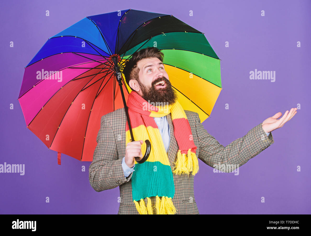 An umbrella is needed on a rainy day. Autistic or rain man holding ...