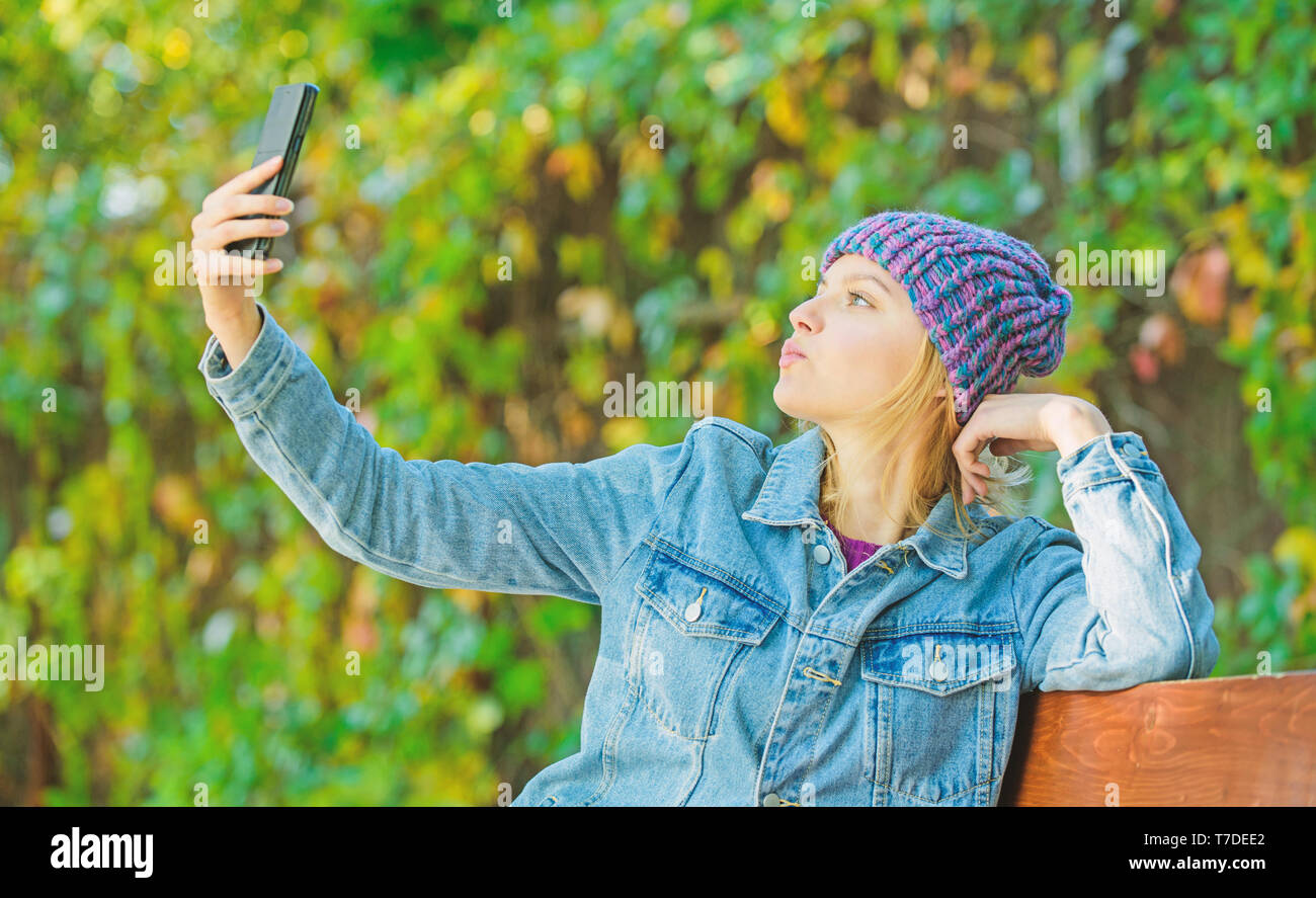 Girl with smartphone green nature background. Woman having mobile ...