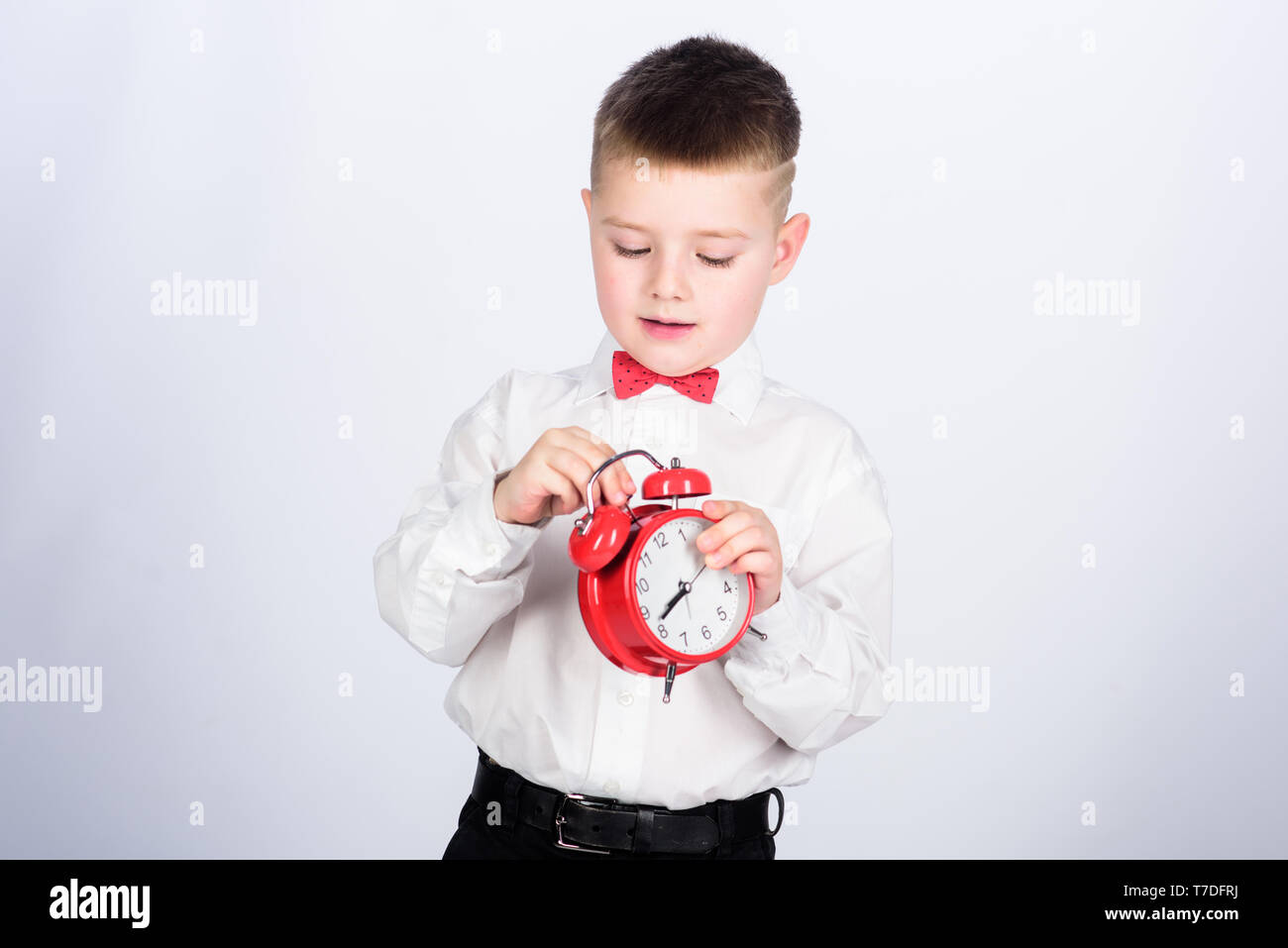 Time management. Morning. little boy with alarm clock. Time to relax ...