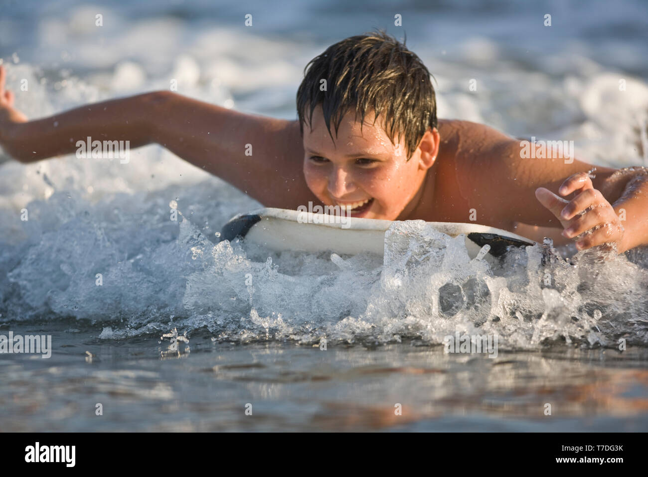 Boy boogie boarding Stock Photo - Alamy