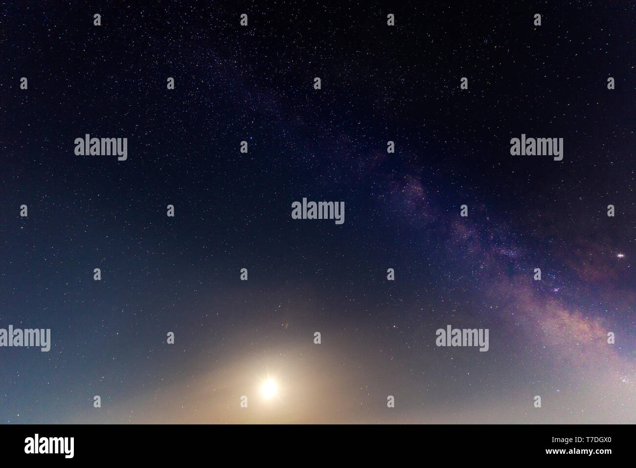 The Milky Way and the moon in the night sky Stock Photo - Alamy