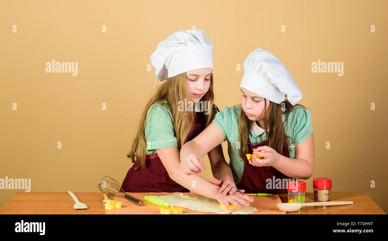 They like cooking. Adorable little girls enjoy cooking together. Small ...