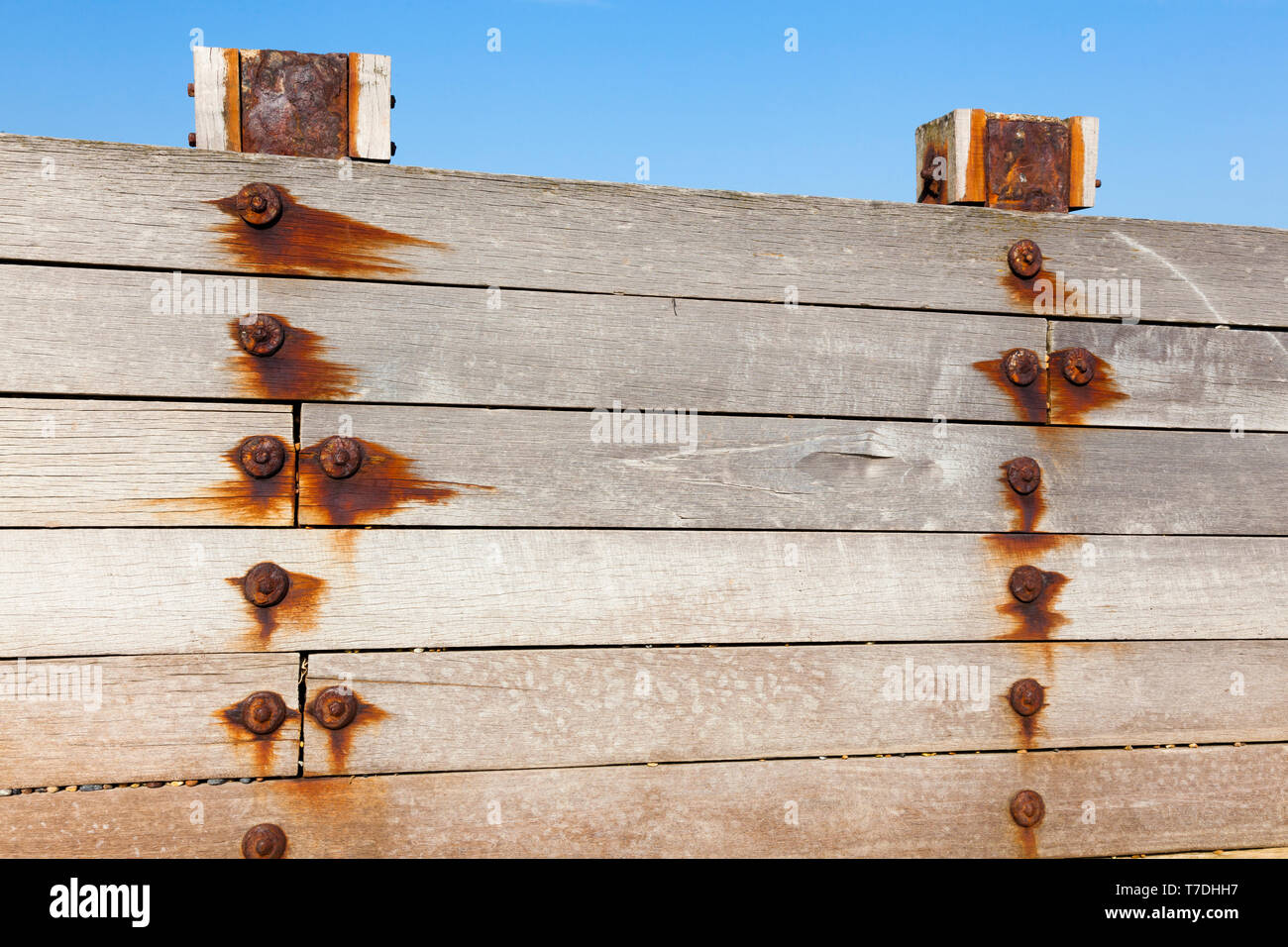Wooden and concrete groynes, protect pebbly beach from erosion. St ...